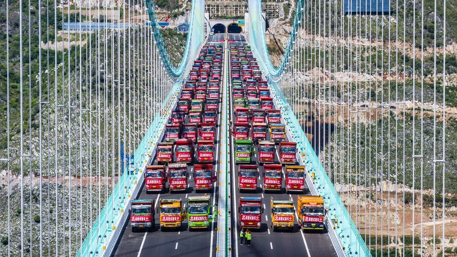 Xinhua Headlines: World's highest bridge opens to traffic in China's ...
